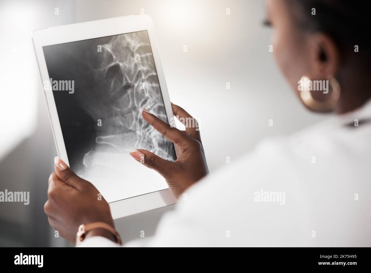 Its like a filing cabinet full of digital scans. a doctor analysing an ...