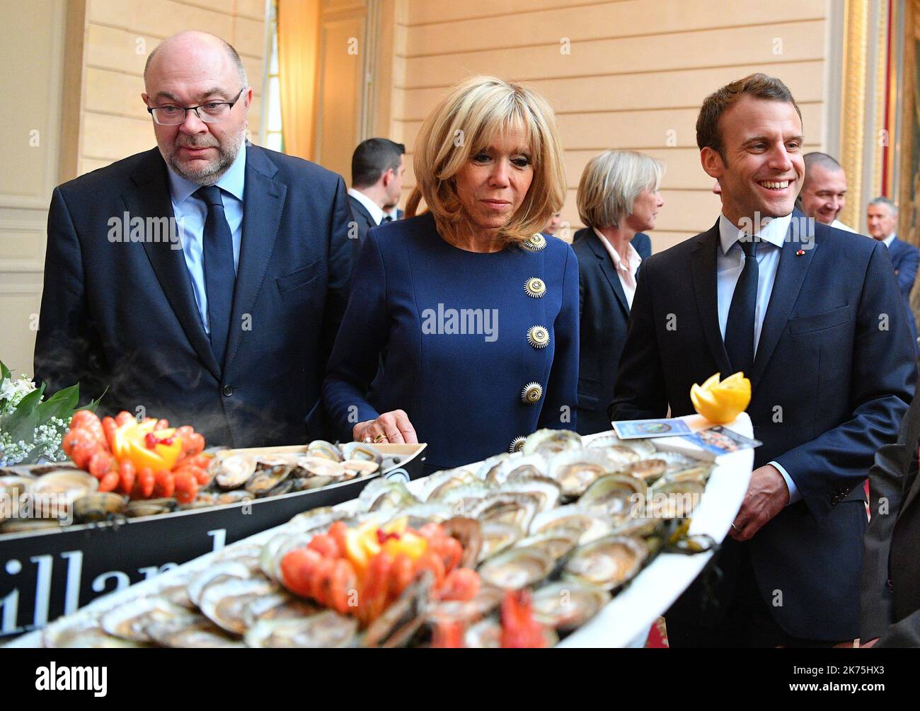 French President Emmanuel Macron and his wife Brigitte Macron and ...