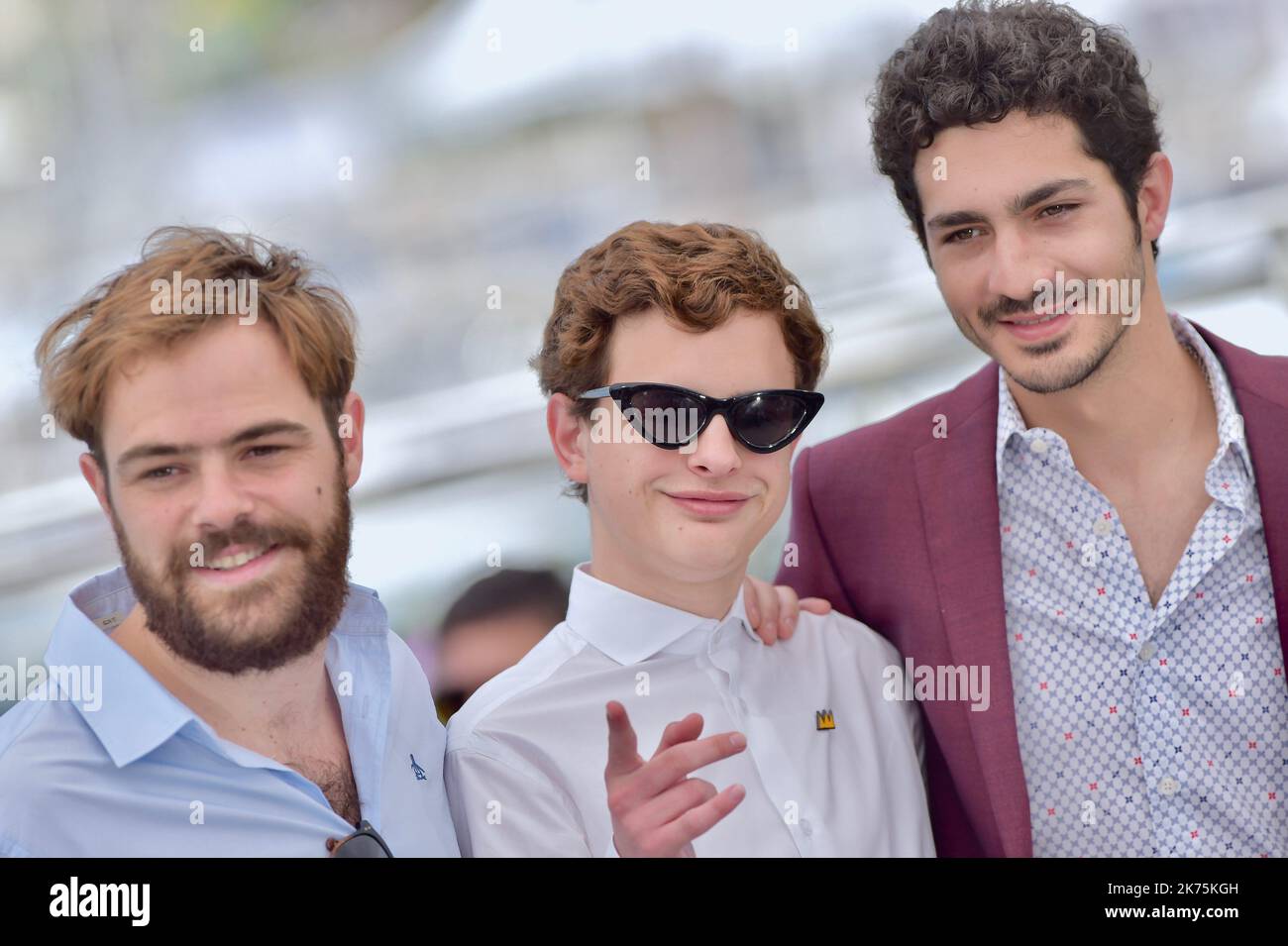 Actor Lorenzo Ferro (C) makes a hand gesture as he poses with actors ...