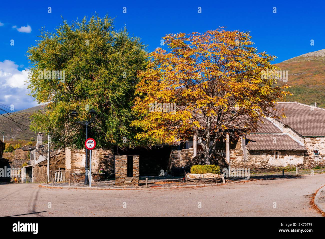 Route of the black villages. Autumn colors. Street of El Espinar, a ...