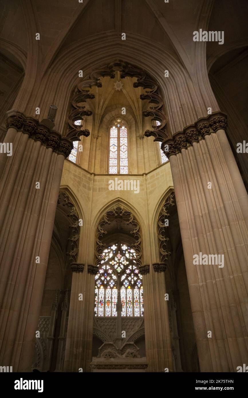 Architectural details and stained glass windows in the interior of the ...