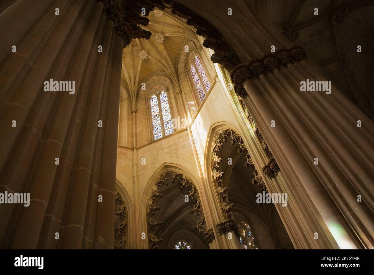 Architectural details and stained glass windows in the interior of the ...