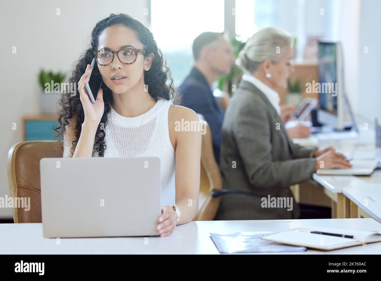 Making new connections every day. a young businesswoman on a call in an ...