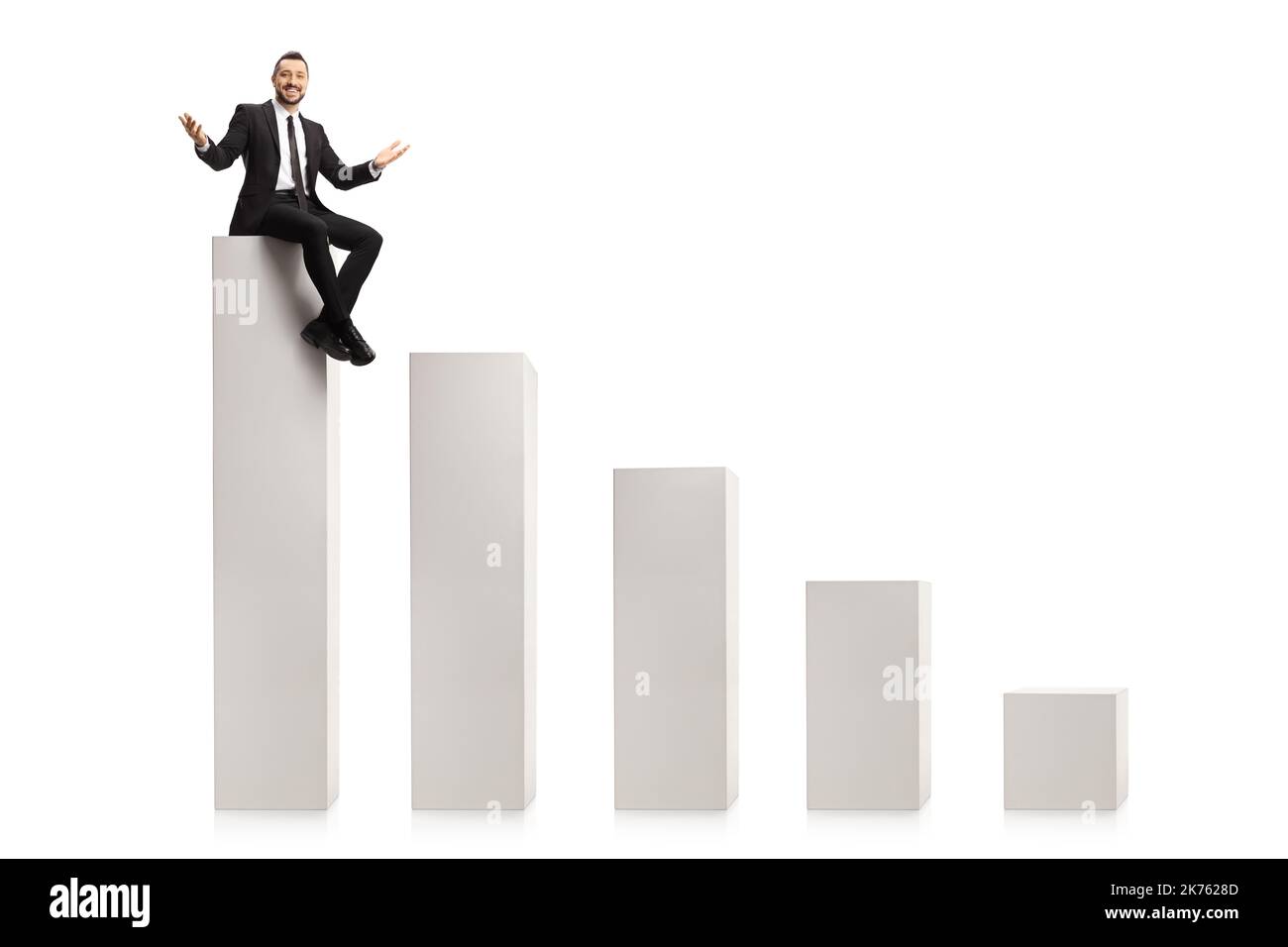 Cheerful businessman sitting on a bar chart column and smiling at ...