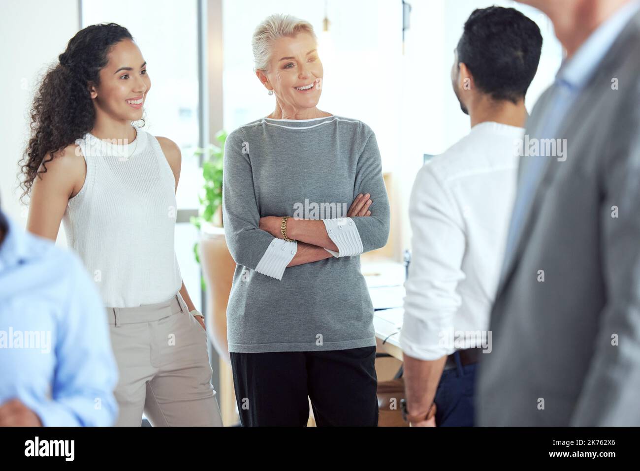 Getting to know the team. a group of businesspeople talking in an ...