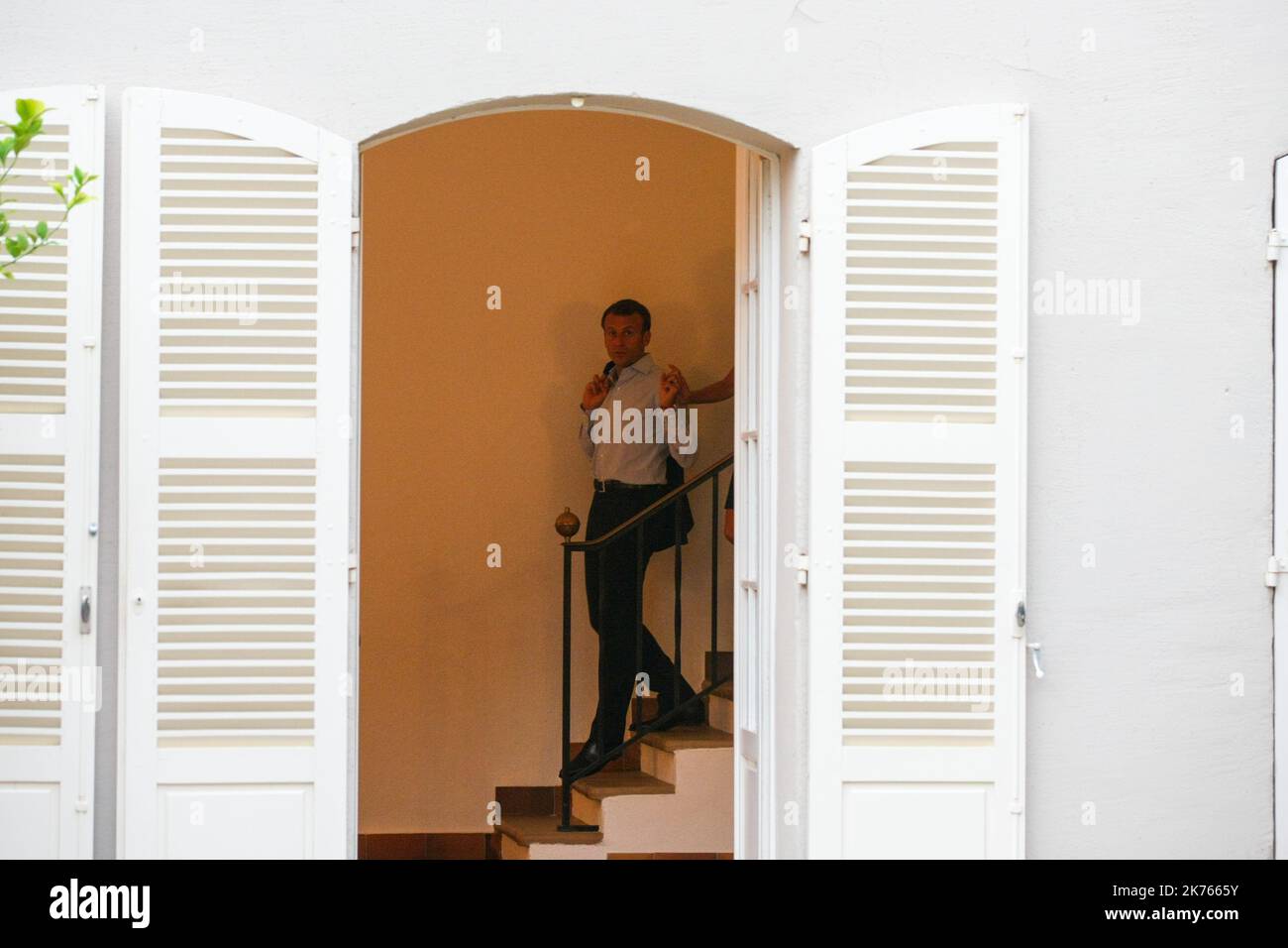 French President Emmanuel Macron and his wife Brigitte Macron walk ...