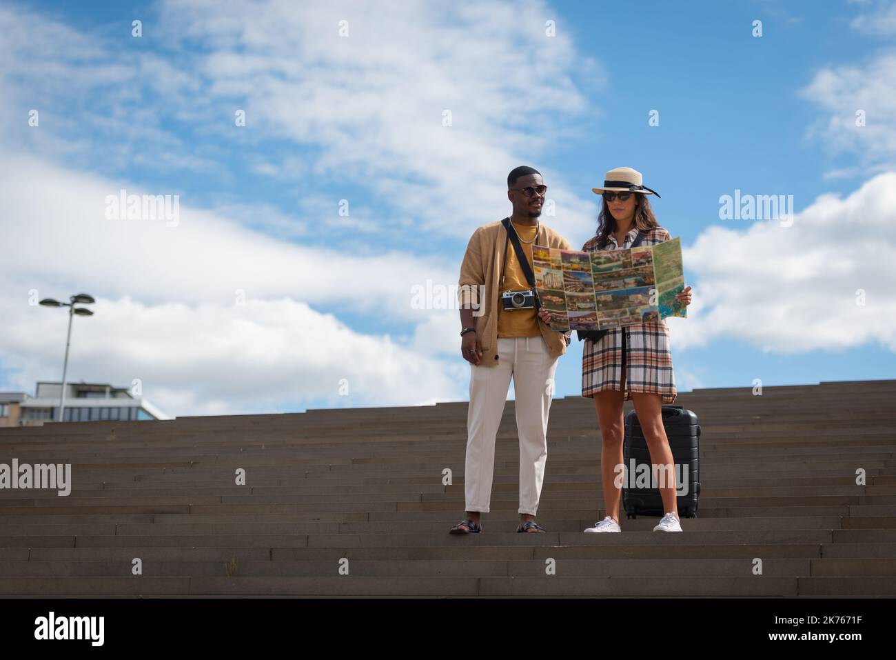 Two friends hanging out, looking for a new place on the map to visit ...