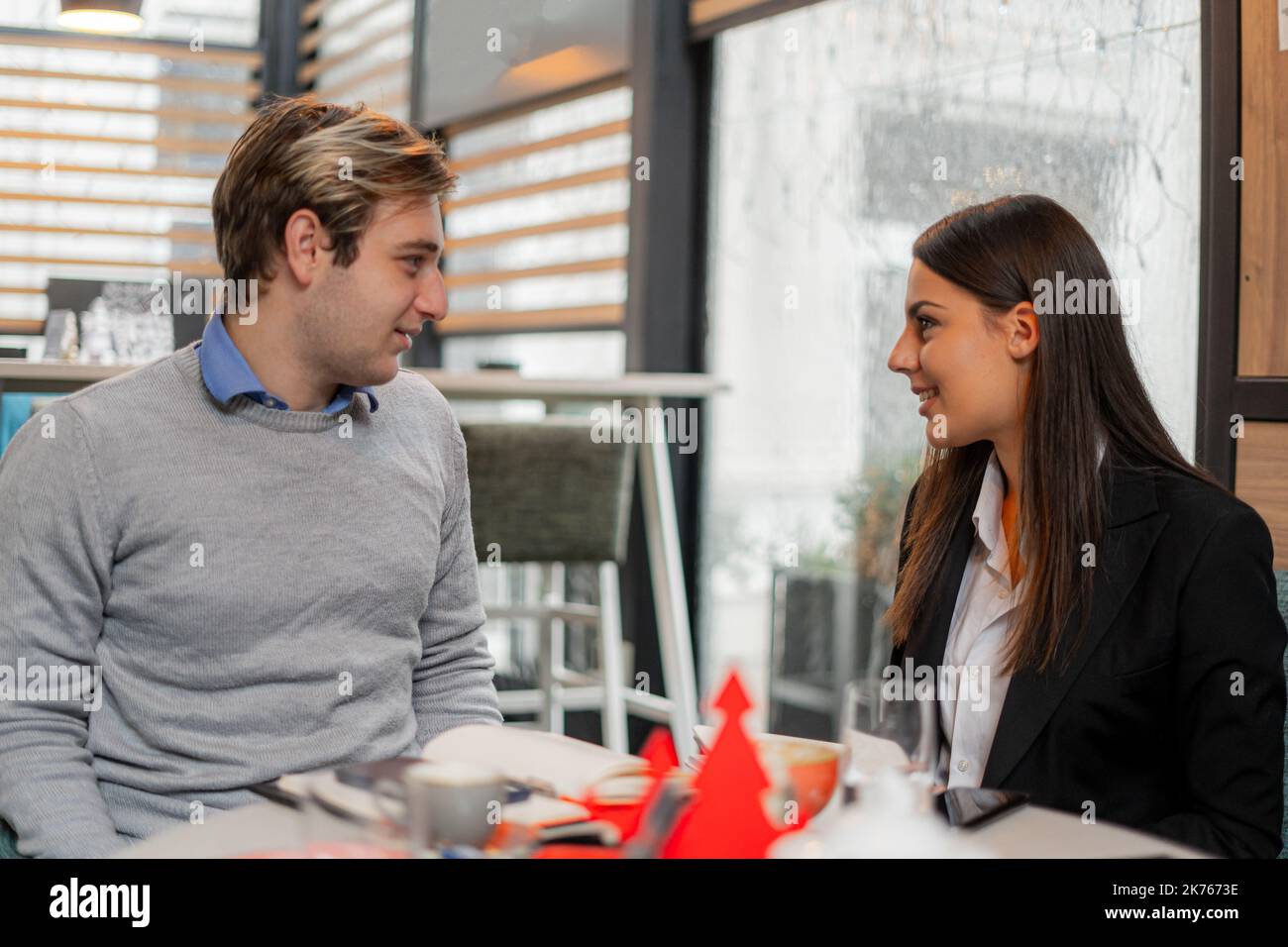 Two young and amazing business people are having a conversation Stock ...