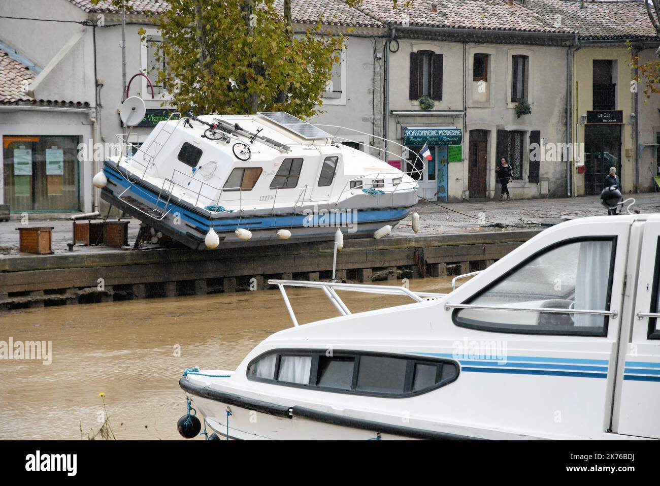 A boat left out of the canal after flooding Stock Photo - Alamy