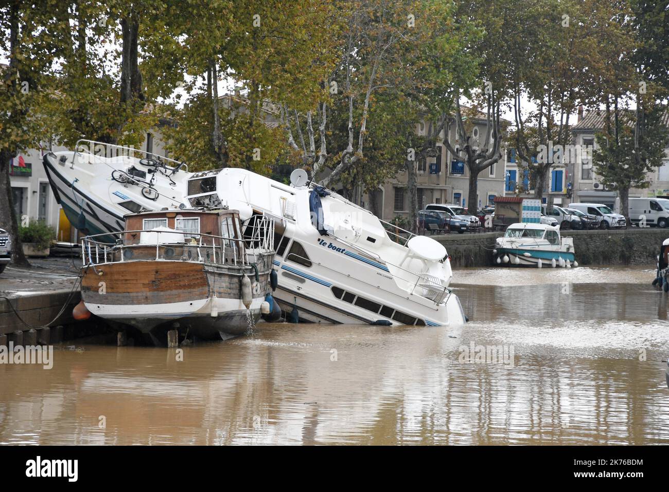 A boat left out of the canal after flooding Stock Photo - Alamy