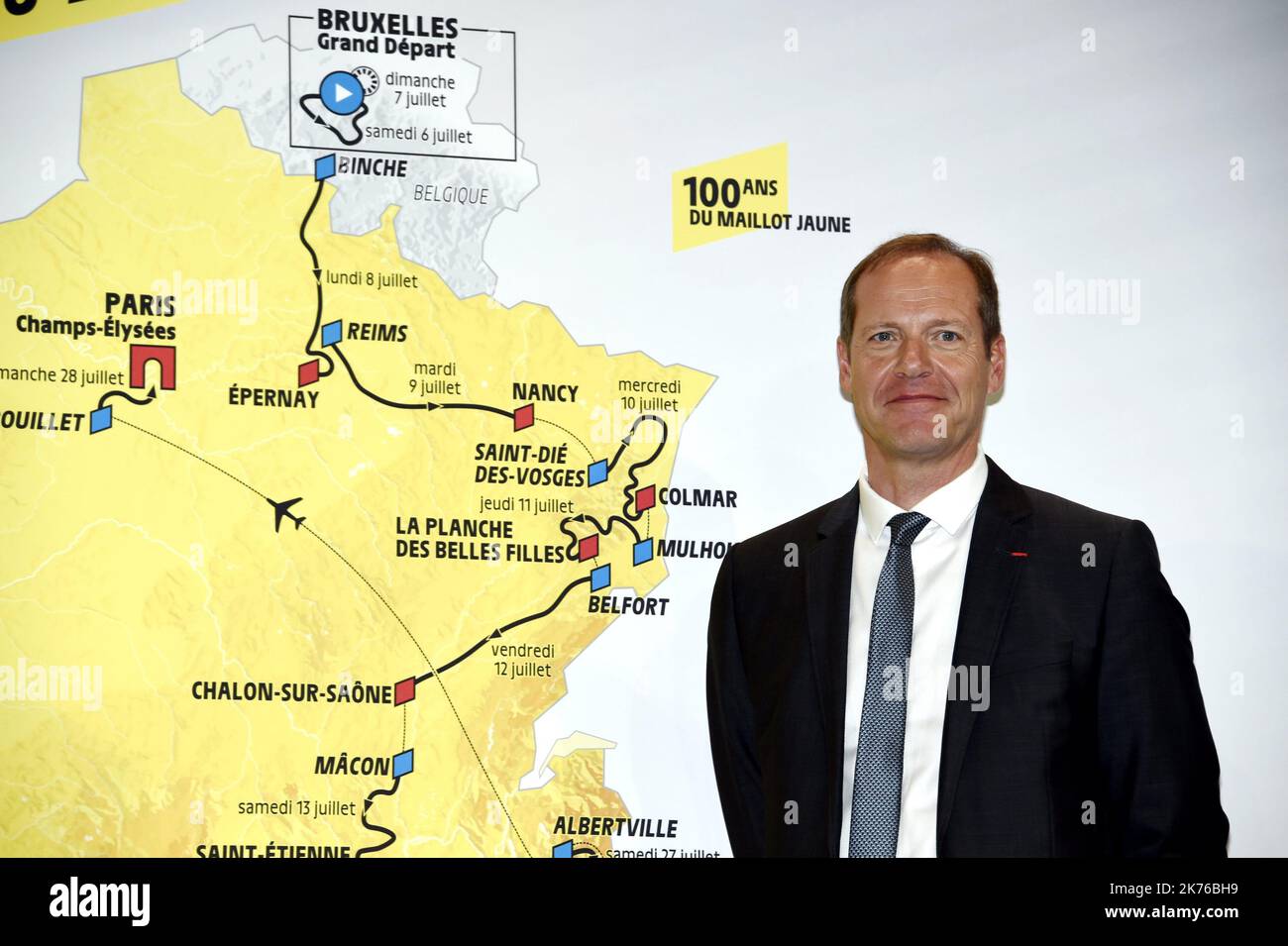 Tour de France Director Christian Prudhomme poses next to the map ...