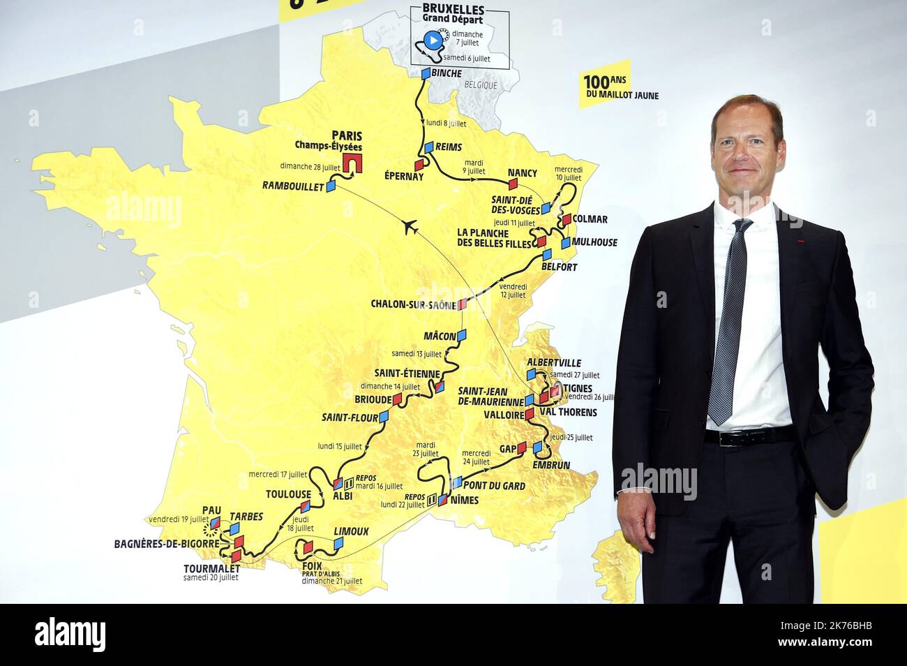 Tour de France Director Christian Prudhomme poses next to the map ...