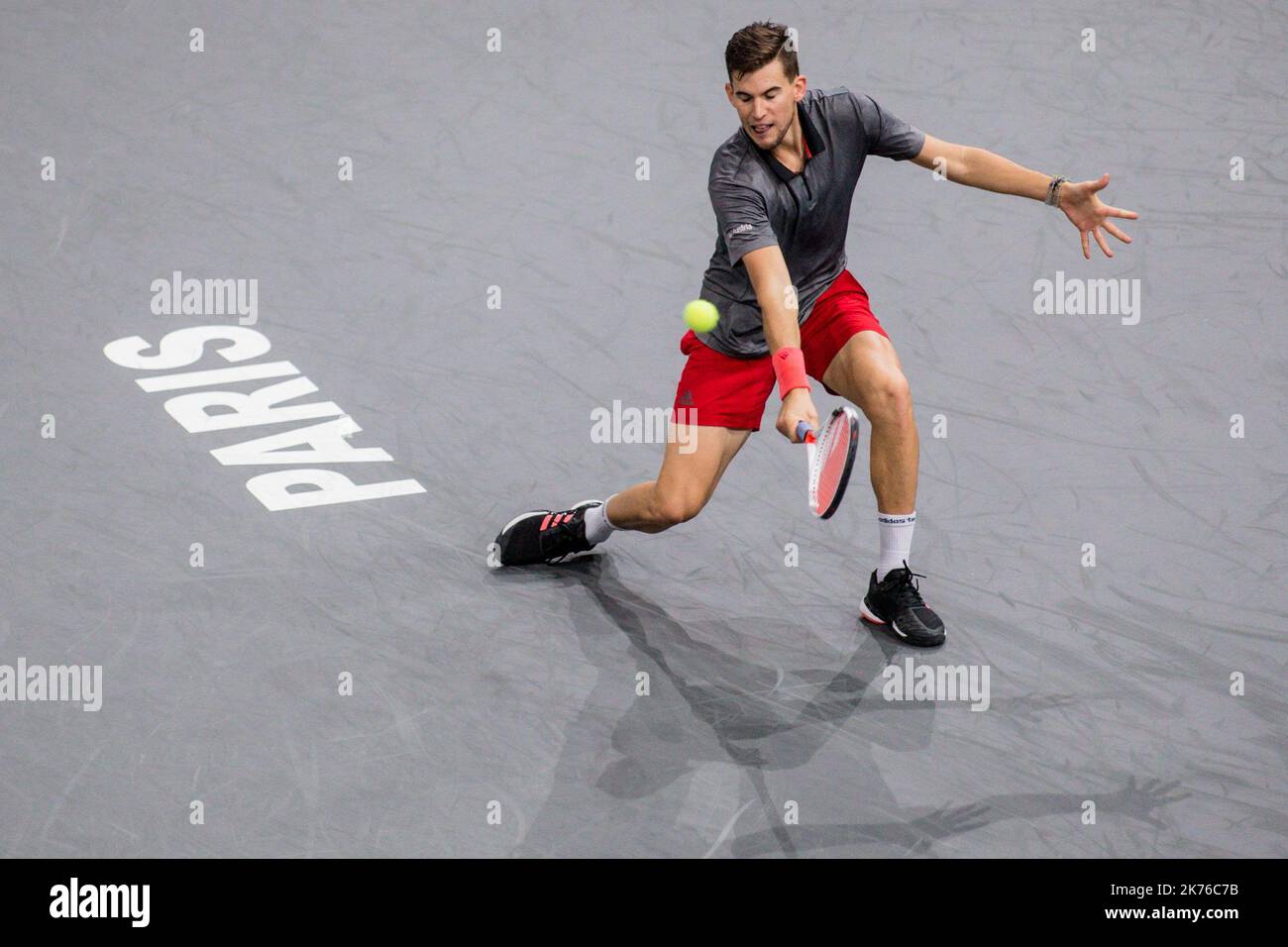 Aurelien Morissard / IP3; Dominic Thiem of Austria plays a backhand ...