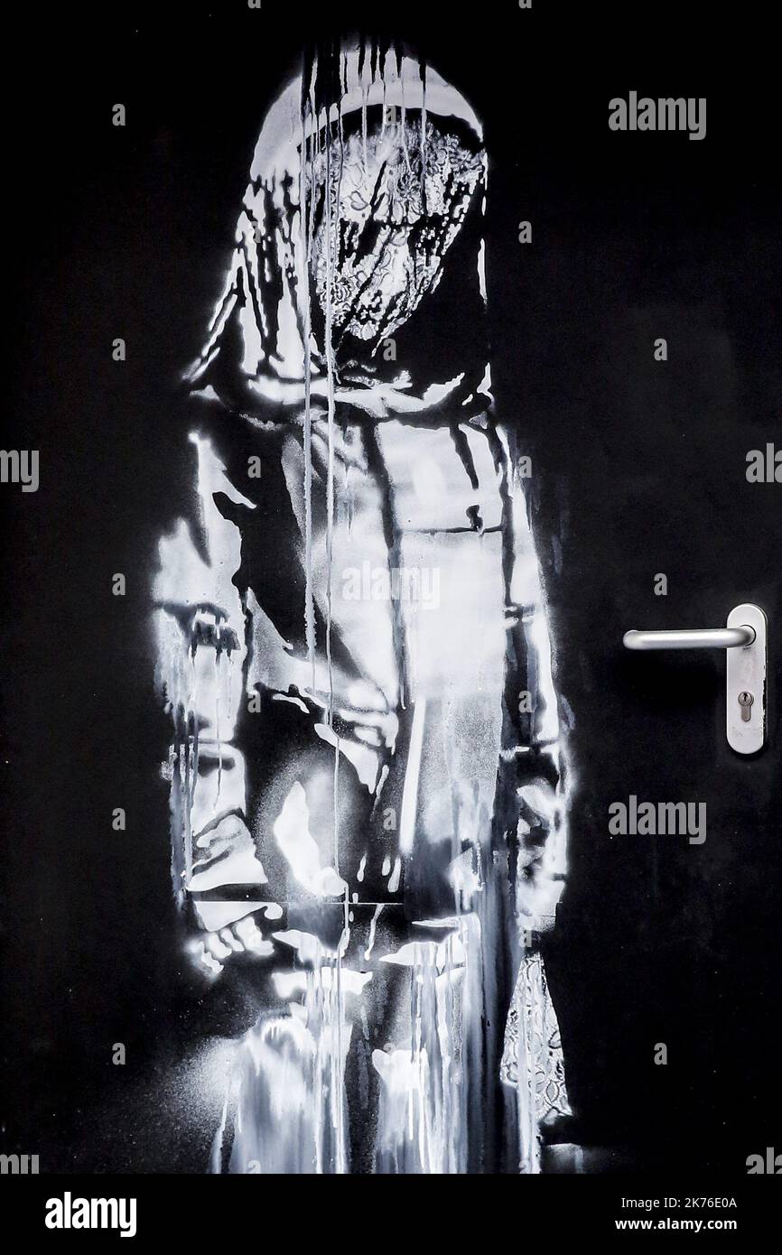 Artwork by street artist Banksy in Paris, on a side street to the ...