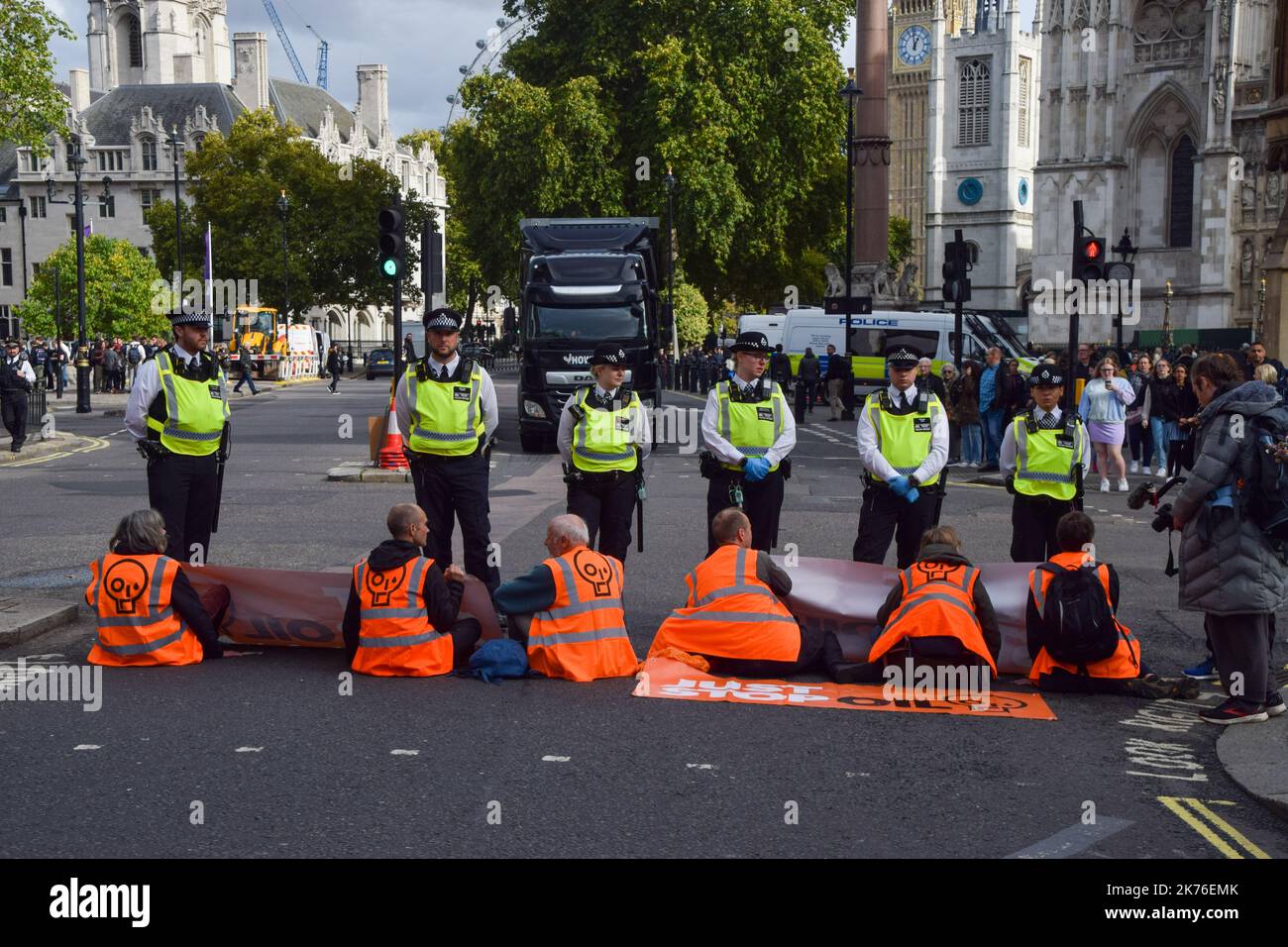 London, UK. 17th October 2022. Protesters, some with their hands glued ...