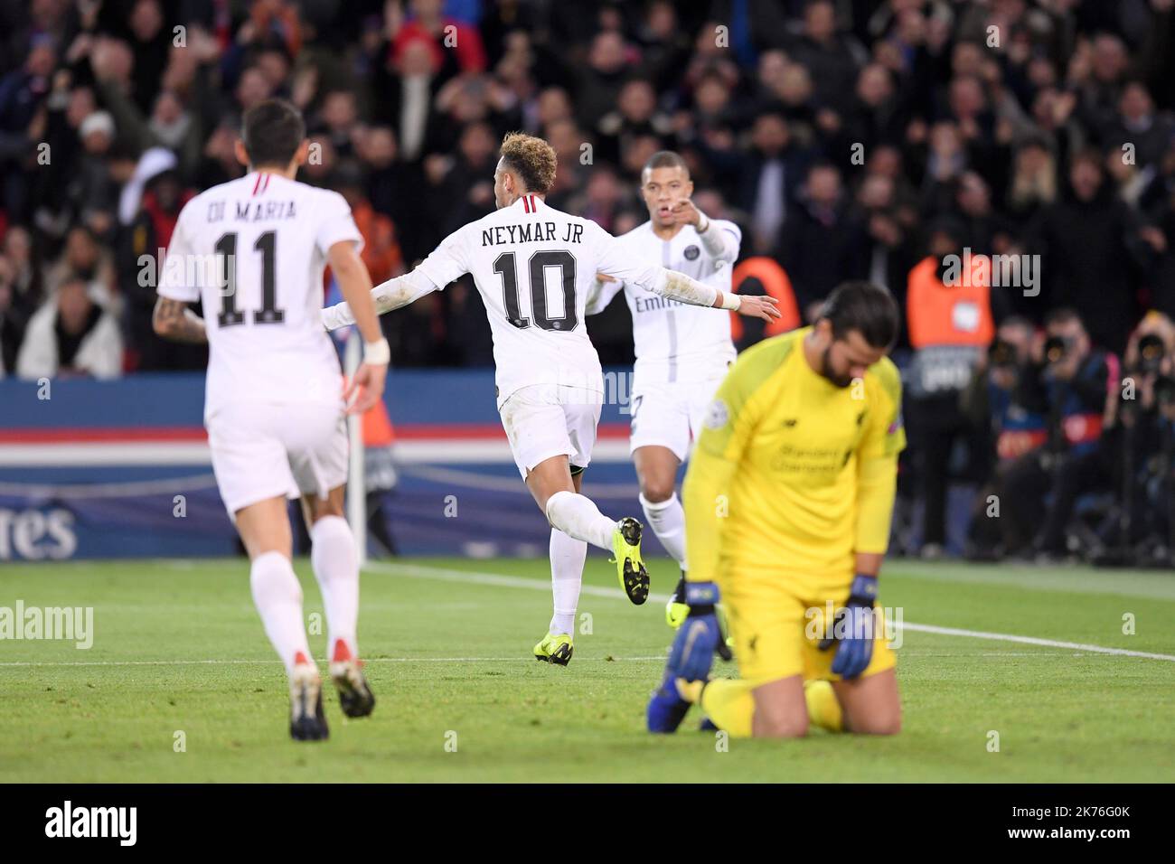 Liverpool goalkeeper Alisson Becker (right) appears dejected after ...