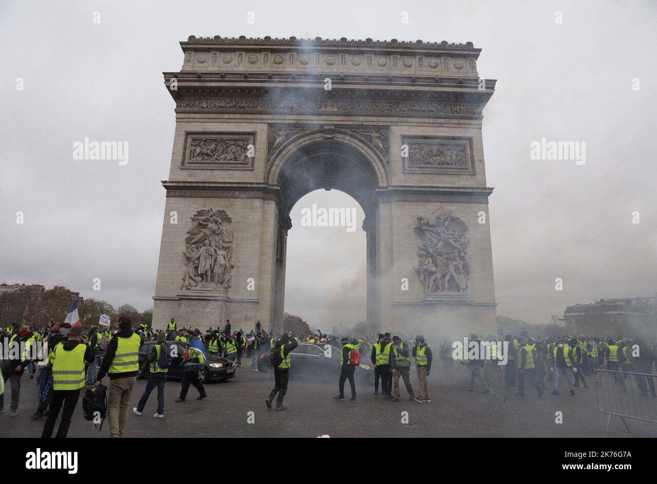 Demonstration of yellow vests in Paris, near the Champs Elysees. Among ...