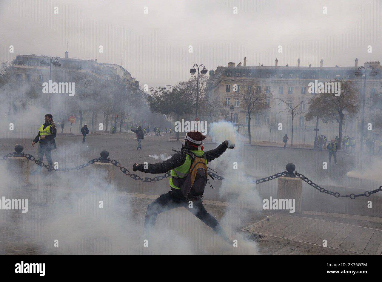 Demonstration of yellow vests in Paris, near the Champs Elysees. Among ...