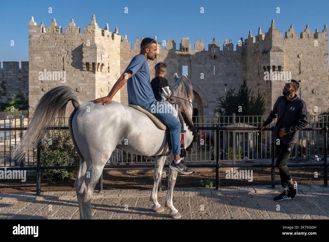 A Palestinian man mounted on a horse in front of Damascus Gate outside ...