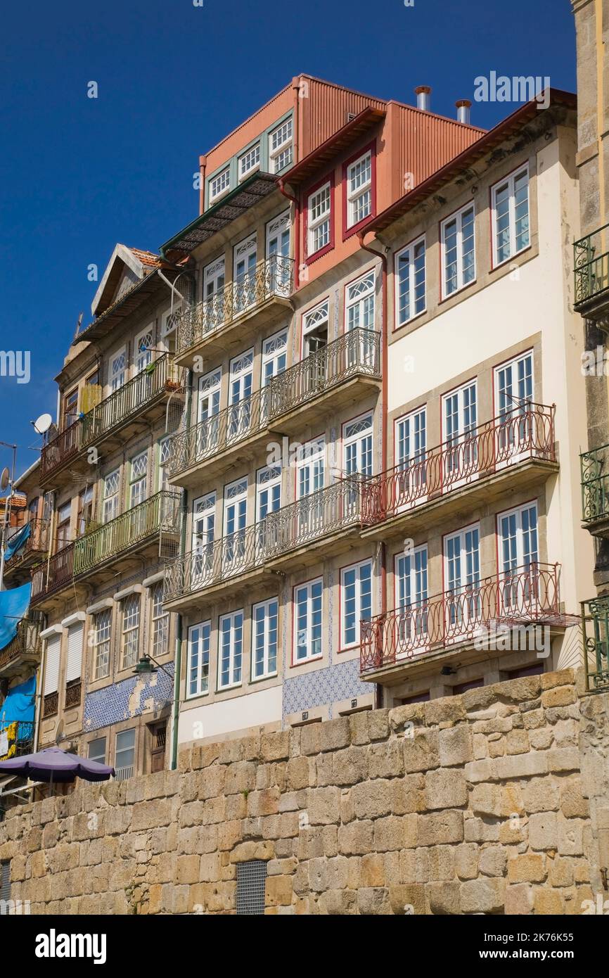 Colourful architectural buildings and stone wall in the old section of ...