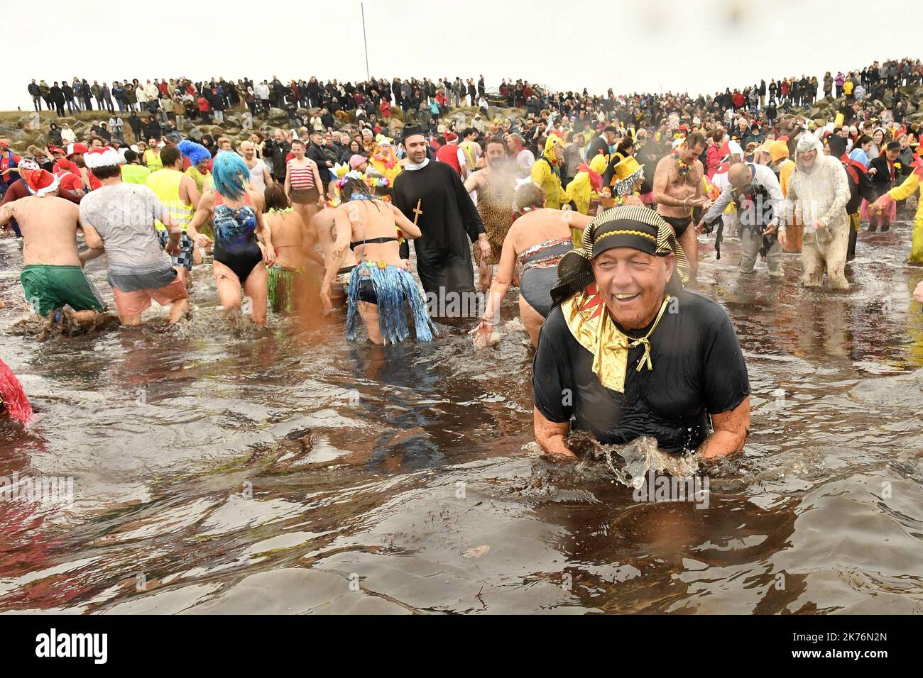People take part in a traditional Christmas sea bath in freezing water ...