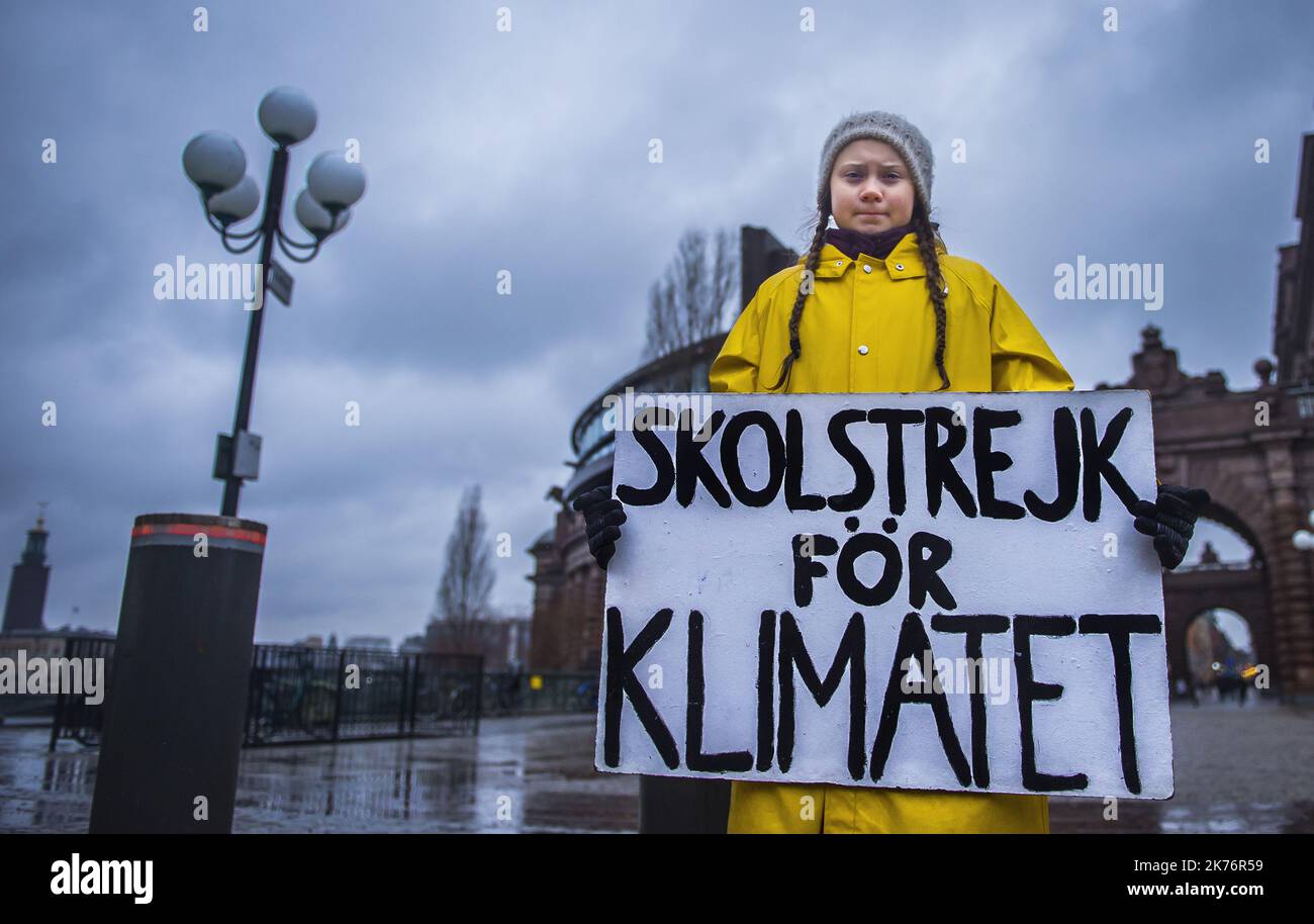 Swedish 15-year-old girl Greta Thunberg holds a placard reading "School ...