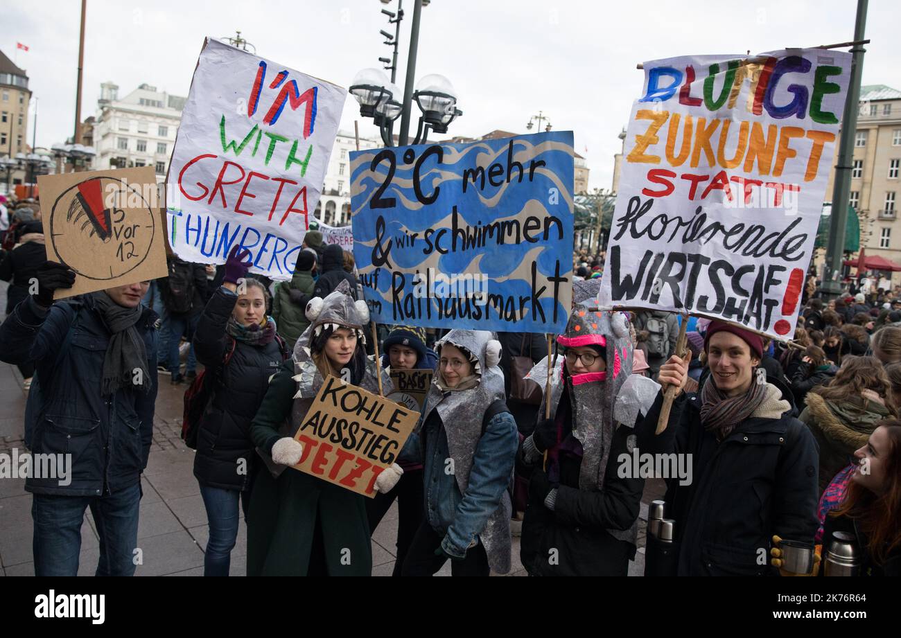 Students demonstrate with self-painted posters in front of the ...