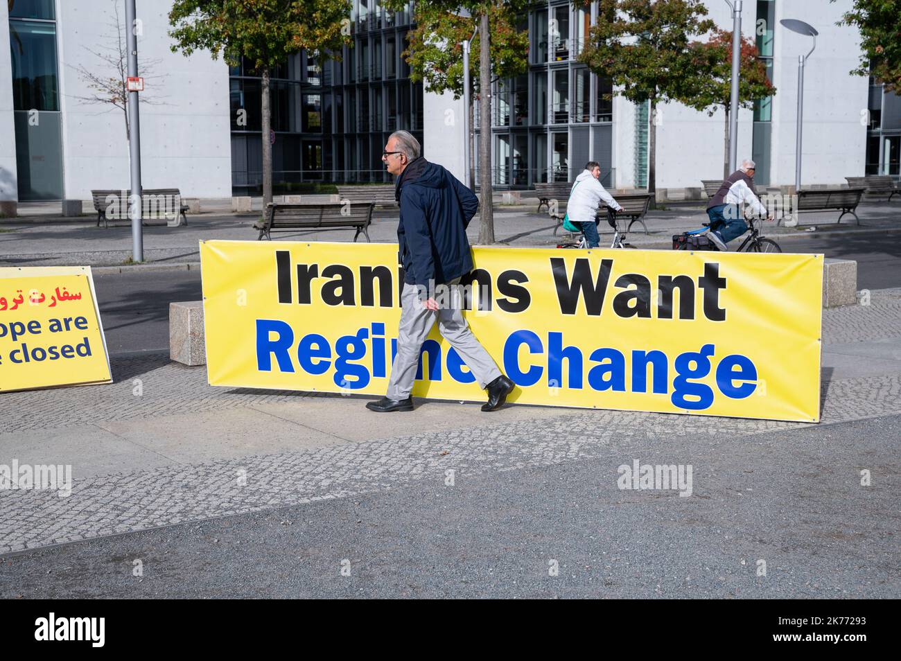 28.09.2022, Berlin, Germany, Europe - An activist carries a banner with ...
