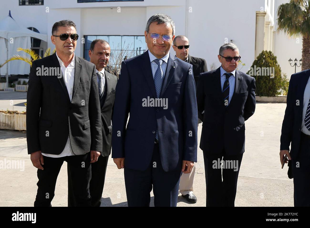 Retired Algerian army general Ali Ghediri (C) stands as he arrives to ...