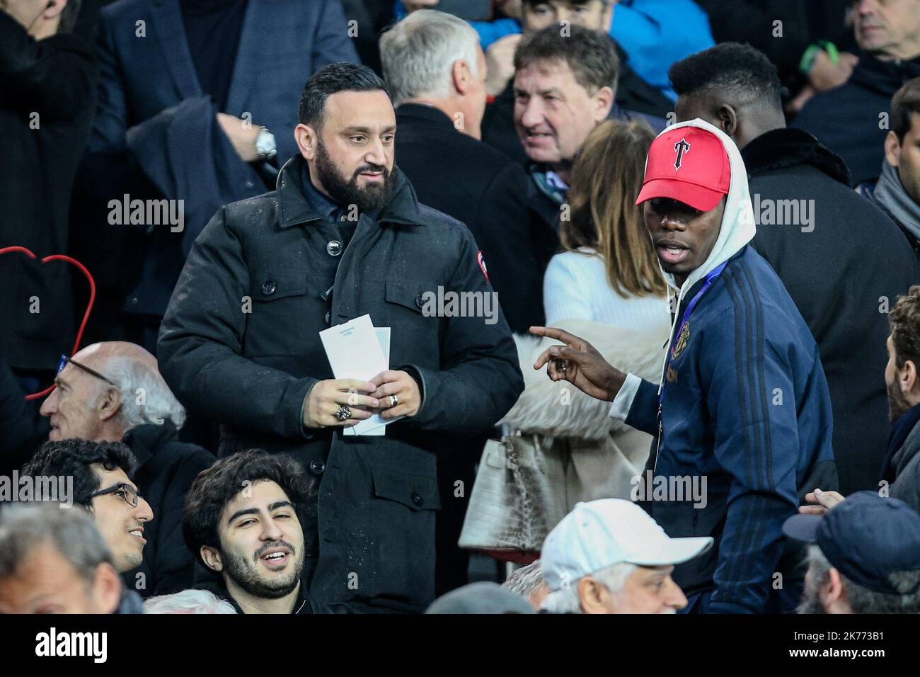 Cyril Hanouna and Paul Pogba during Round of 16, second leg of UEFA ...