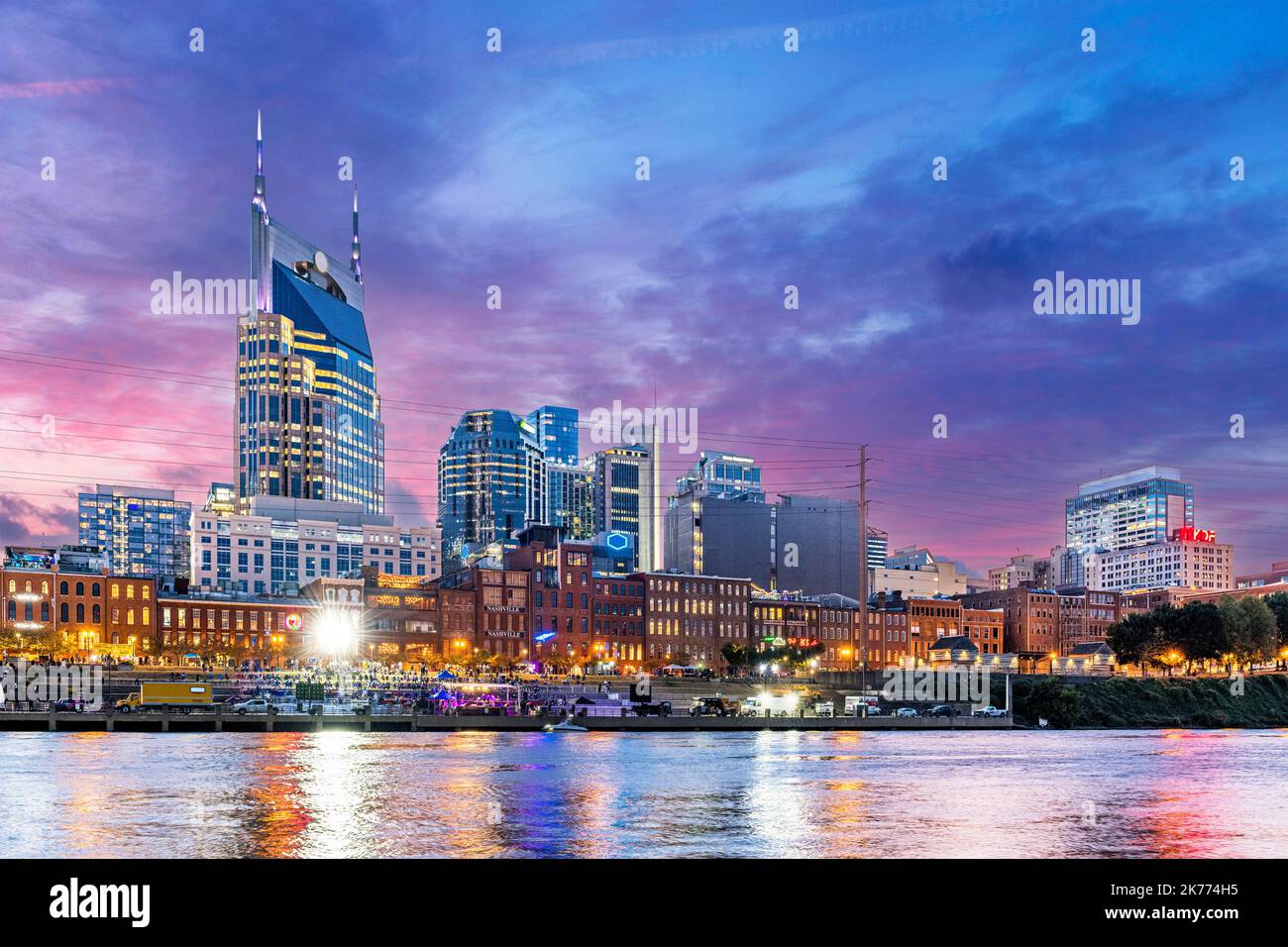 Beautiful mage of famous downtown Nashville along the river shows a vibrant waterfront tourist ...