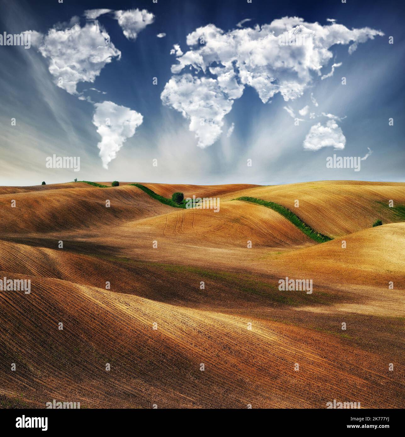 clouds in the form of a map of the world over the field. Travel and ...