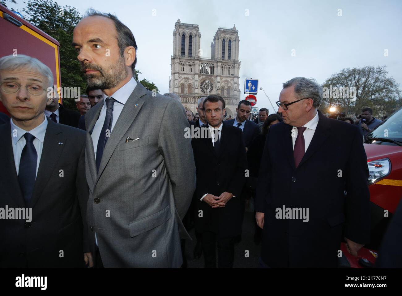 French President Emmanuel Macron walks near the Notre Dame Cathedral as ...