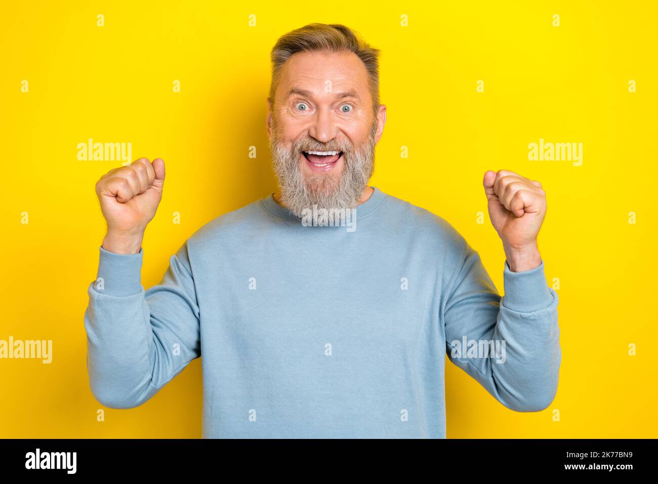Portrait of delighted overjoyed person raise fists luck triumph ...