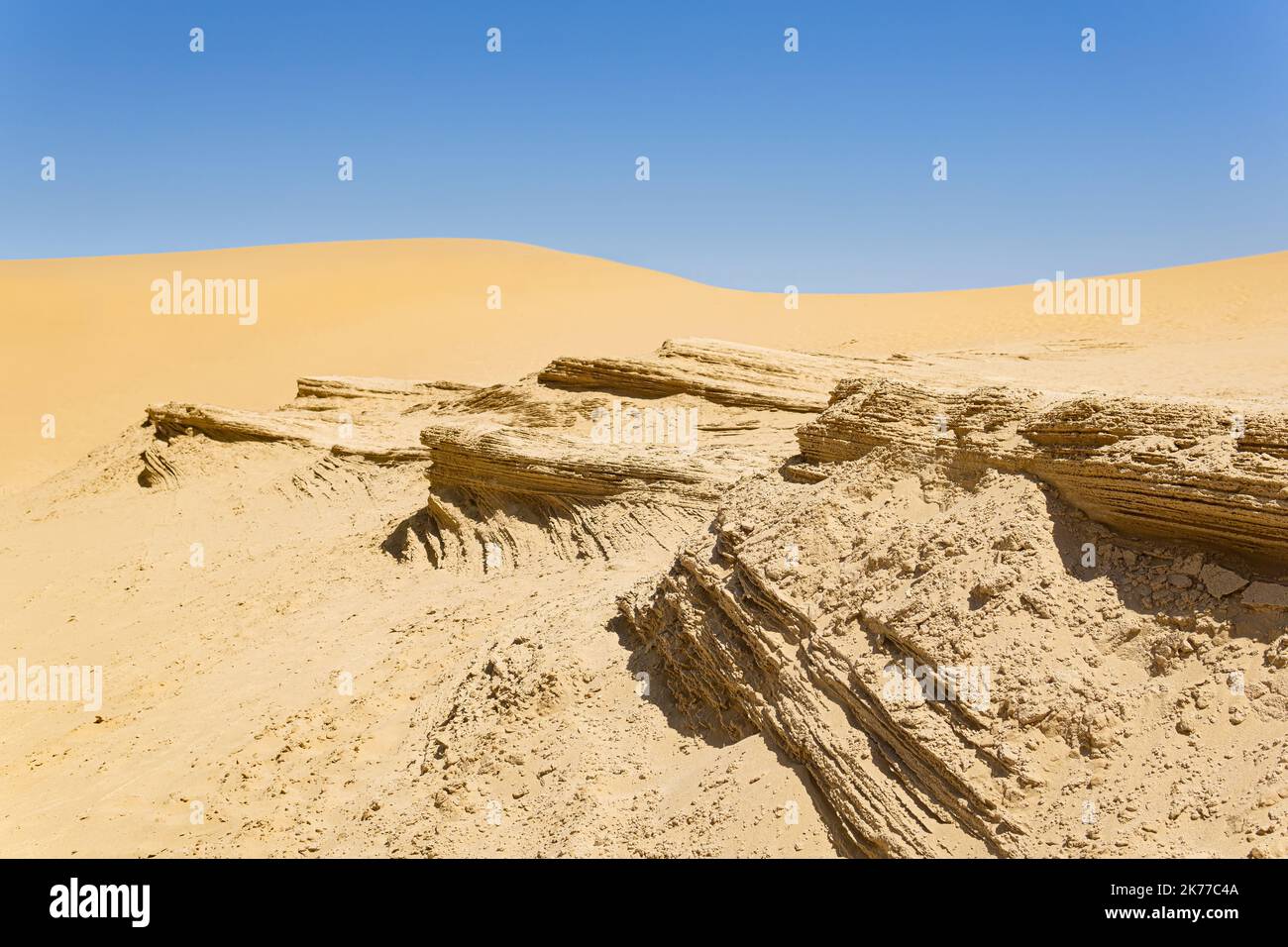 desert landscape, layered sandstone rocks against the background of the ...