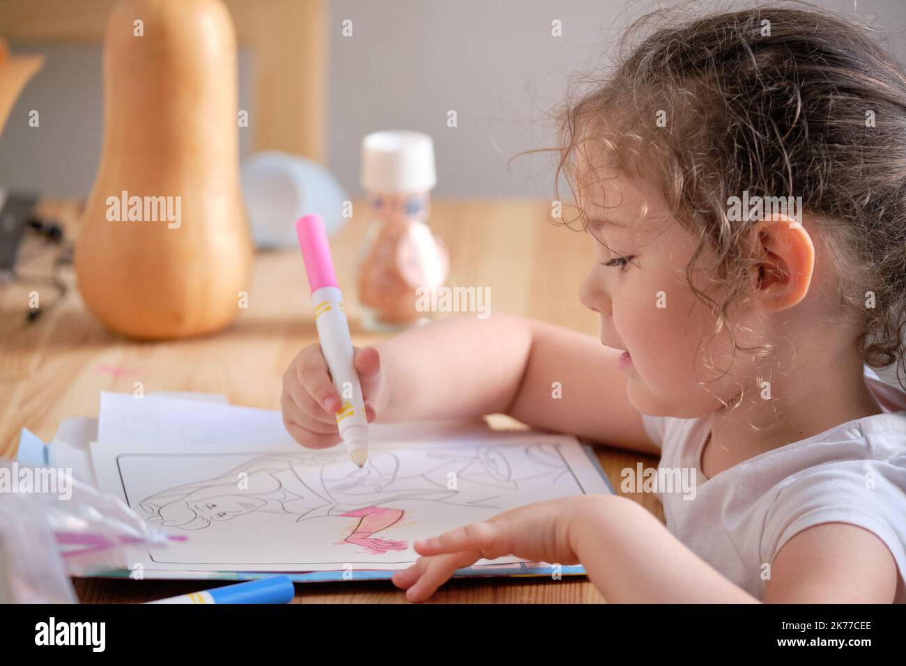 Little girl playing iwth invisible ink and coloring book Stock Photo ...