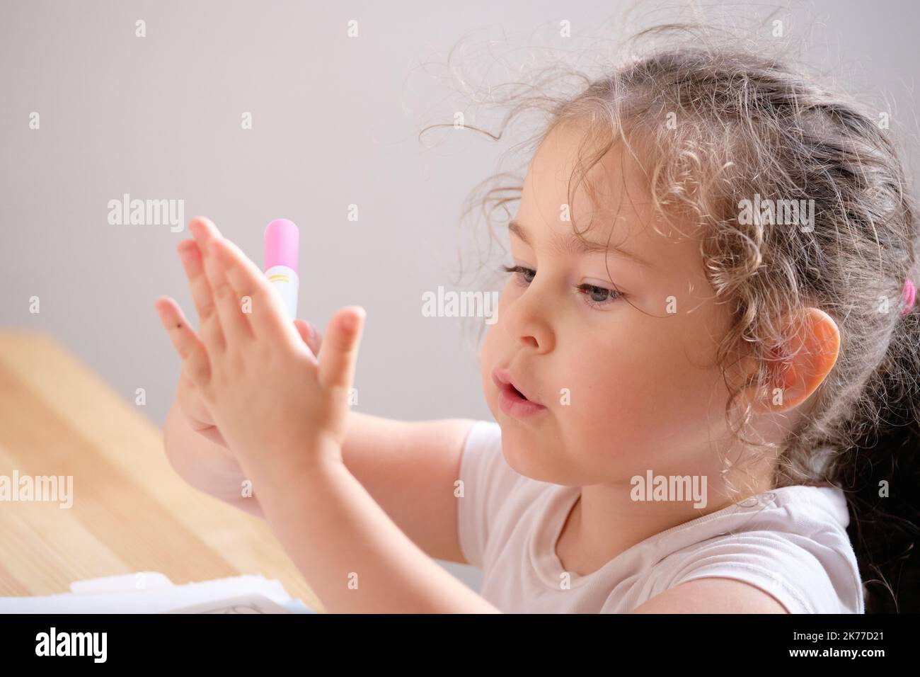 Little girl playing iwth invisible ink and coloring book Stock Photo ...