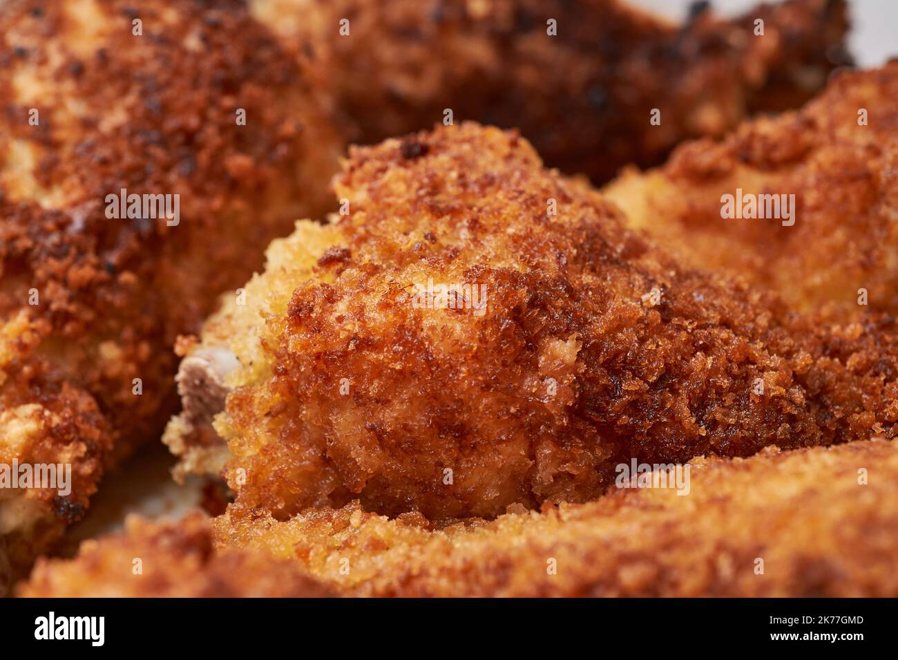 Home made breaded baked chicken legs Stock Photo - Alamy