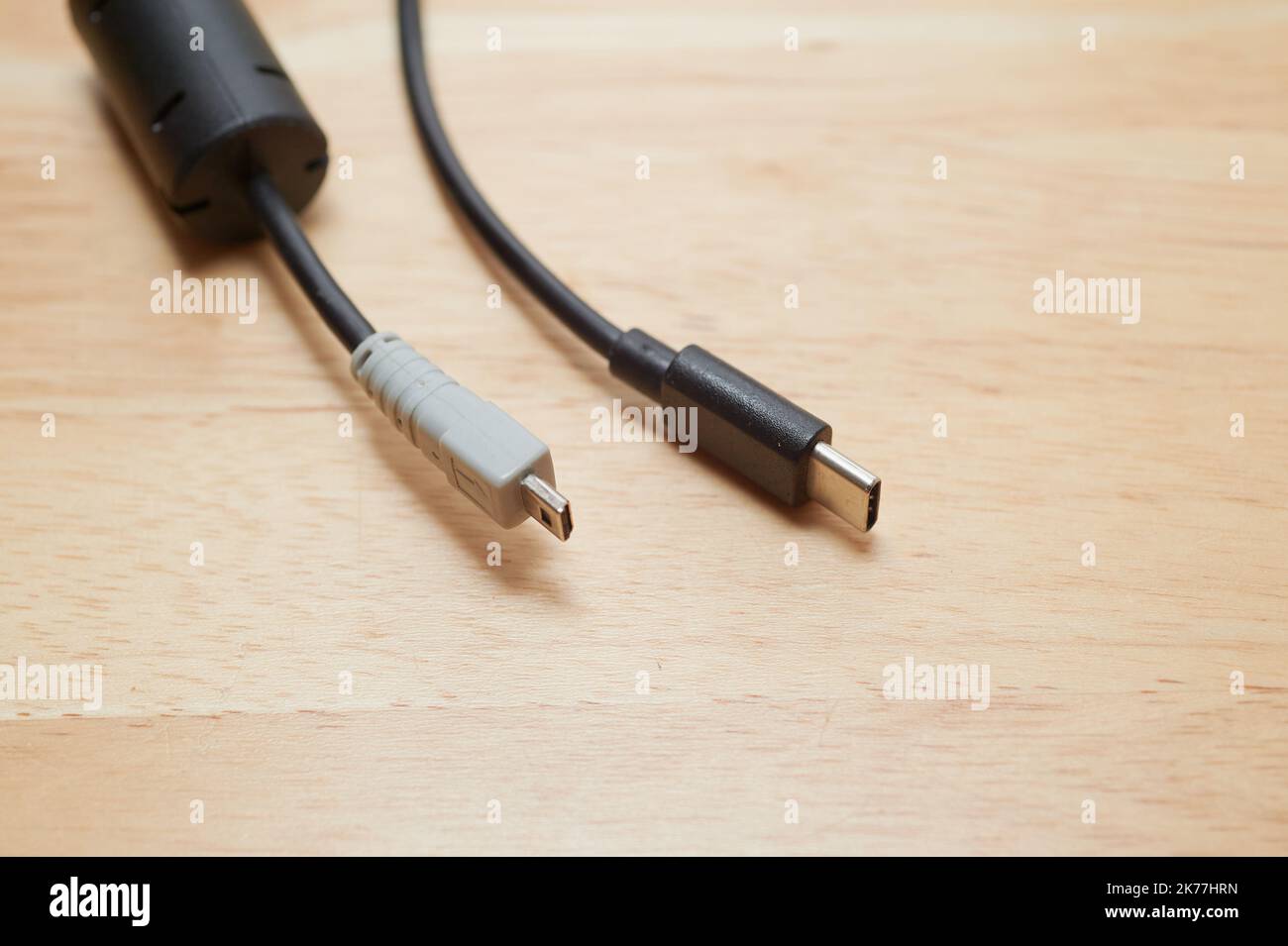 several charging cables lying on a table, including USB A 2.0 and USB C ...