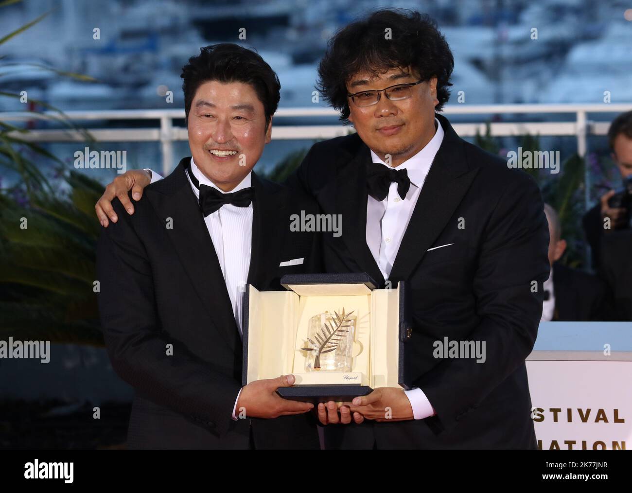 South Korean director Bong Joon-Ho (R) poses during a photocall with ...