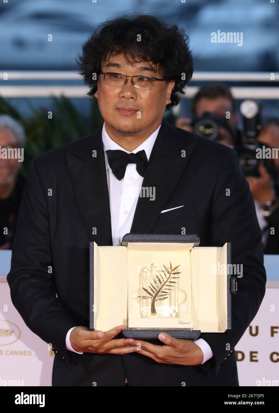 South Korean director Bong Joon-Ho poses during a photocall with his trophy after he won the ...