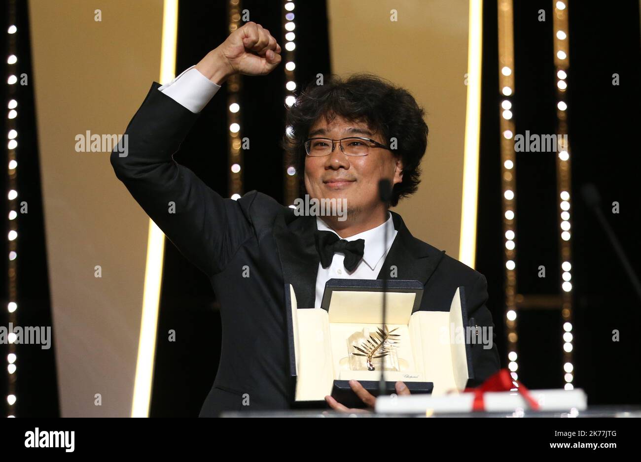 South Korean director Bong Joon-Ho on stage after he won the Palme d'Or ...