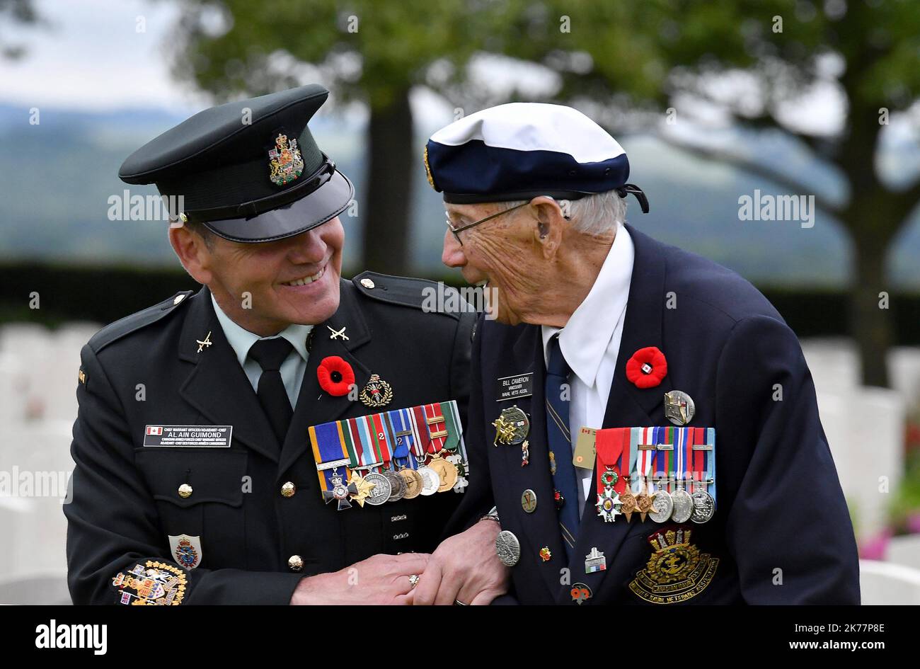 Soldiers and Veterans pay their respects during a service to mark the ...