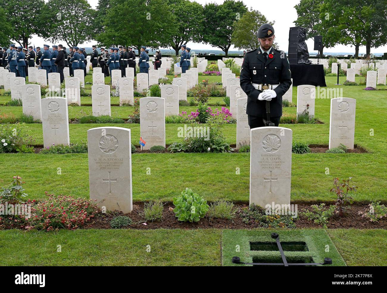 Soldiers and Veterans pay their respects during a service to mark the ...