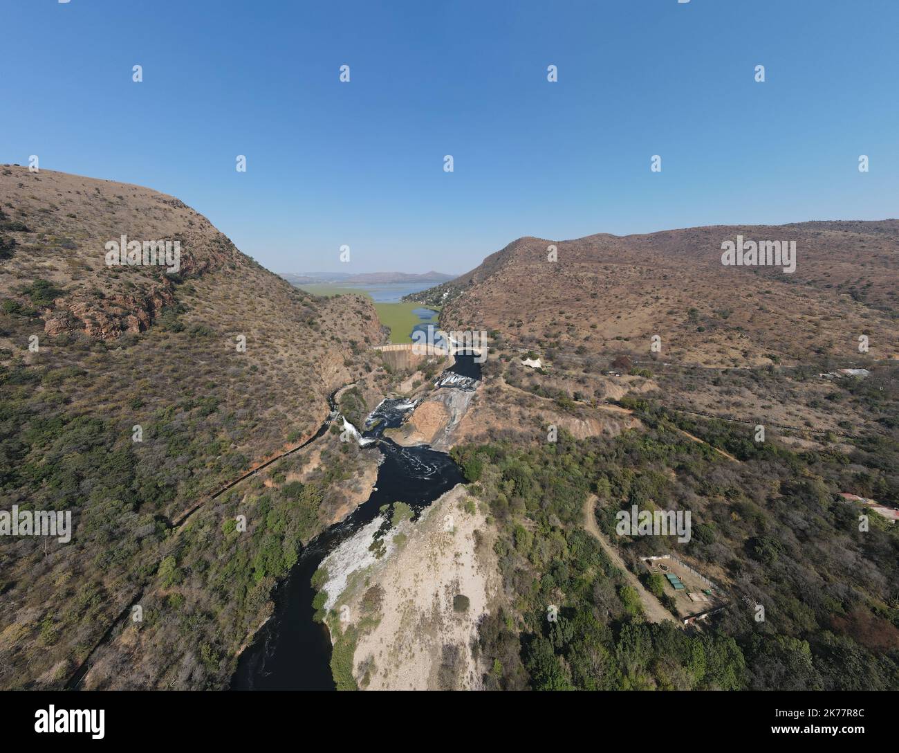 An aerial shot of the town of Hartbeespoort in South Africa under a ...
