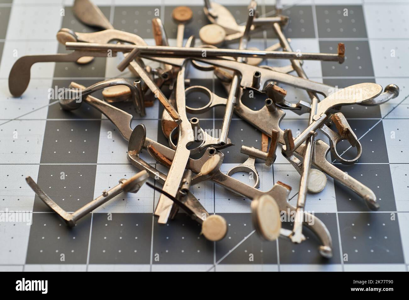 Keys, bell and other various clarinet parts are strewn around the work ...