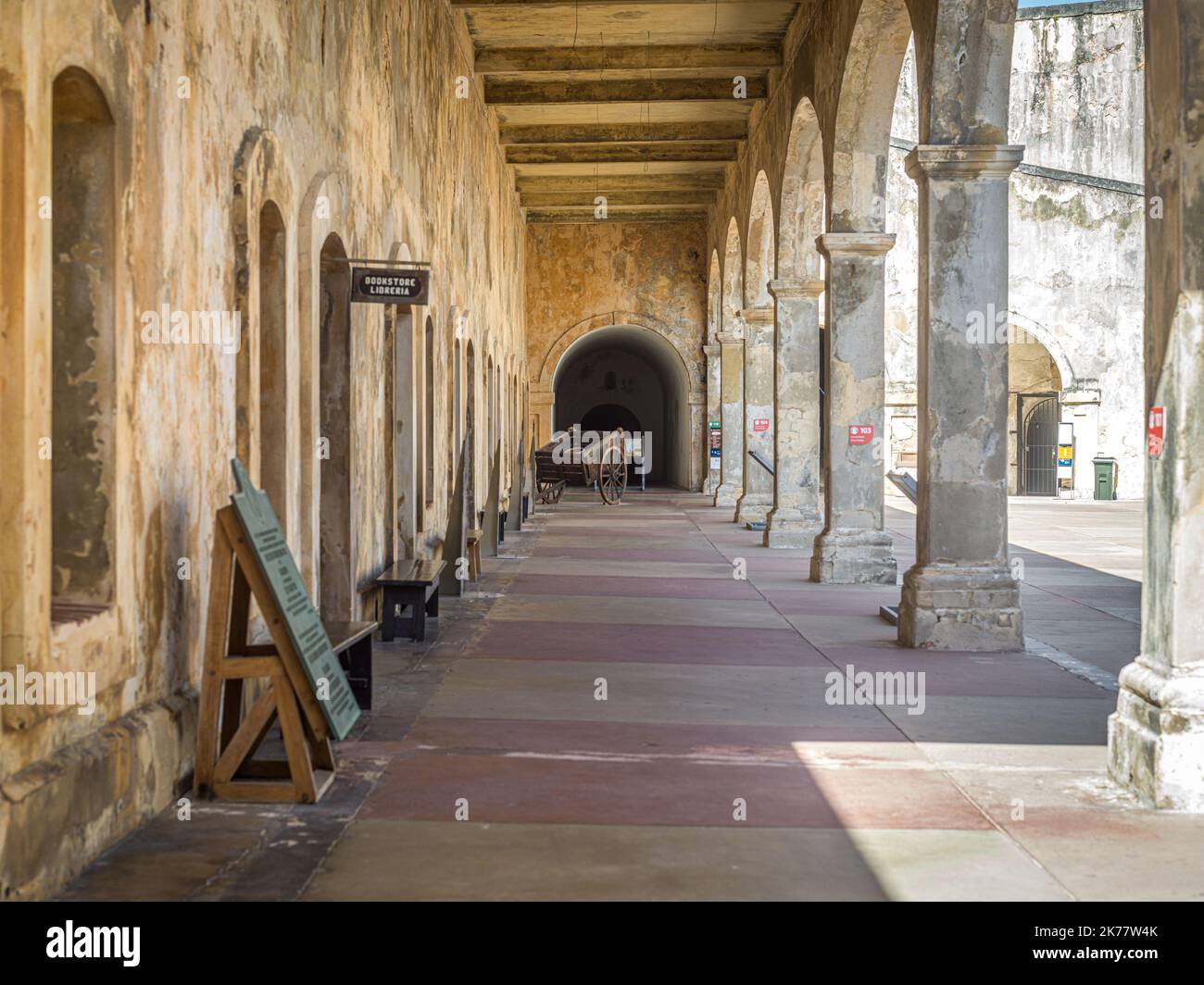 Old wagon at end of hallway at Castillo San Cristobal, San Juan ...