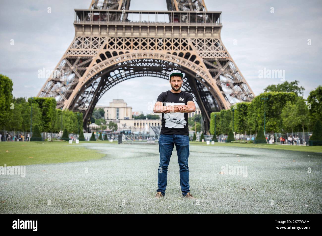 French street artist Saype presents at the Eiffel Tower his giant ...