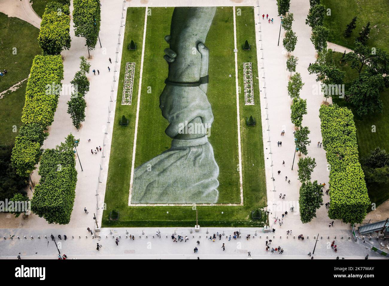 French street artist Saype presents at the Eiffel Tower his giant ...