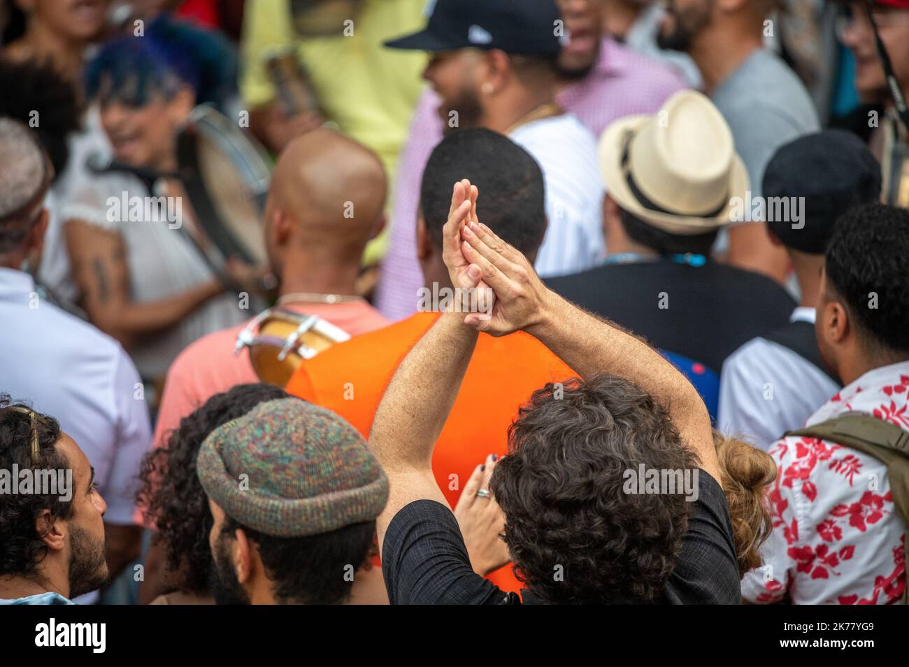 Audience member clapping hands along to Bomba and Plena performance at ...
